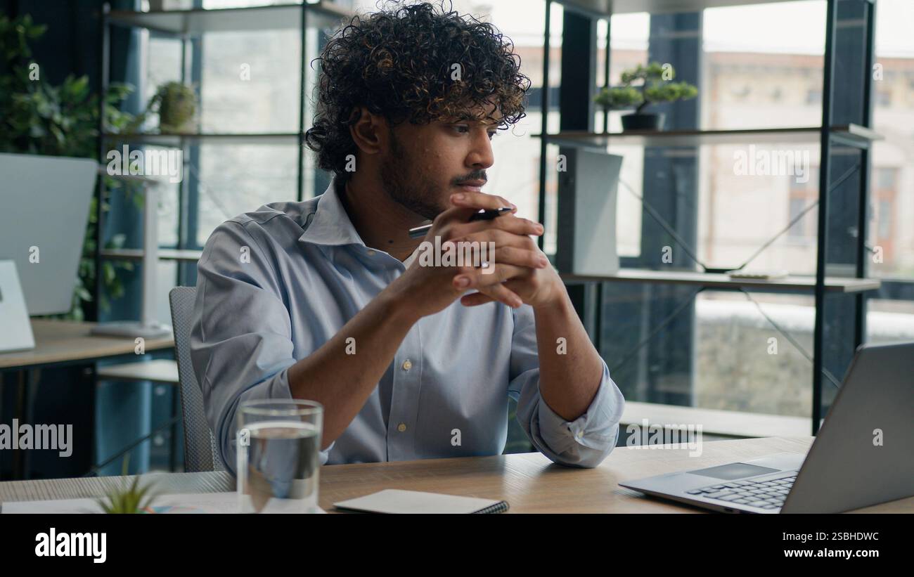 Thoughtful man Arabian Indian businessman employer manager working with ...