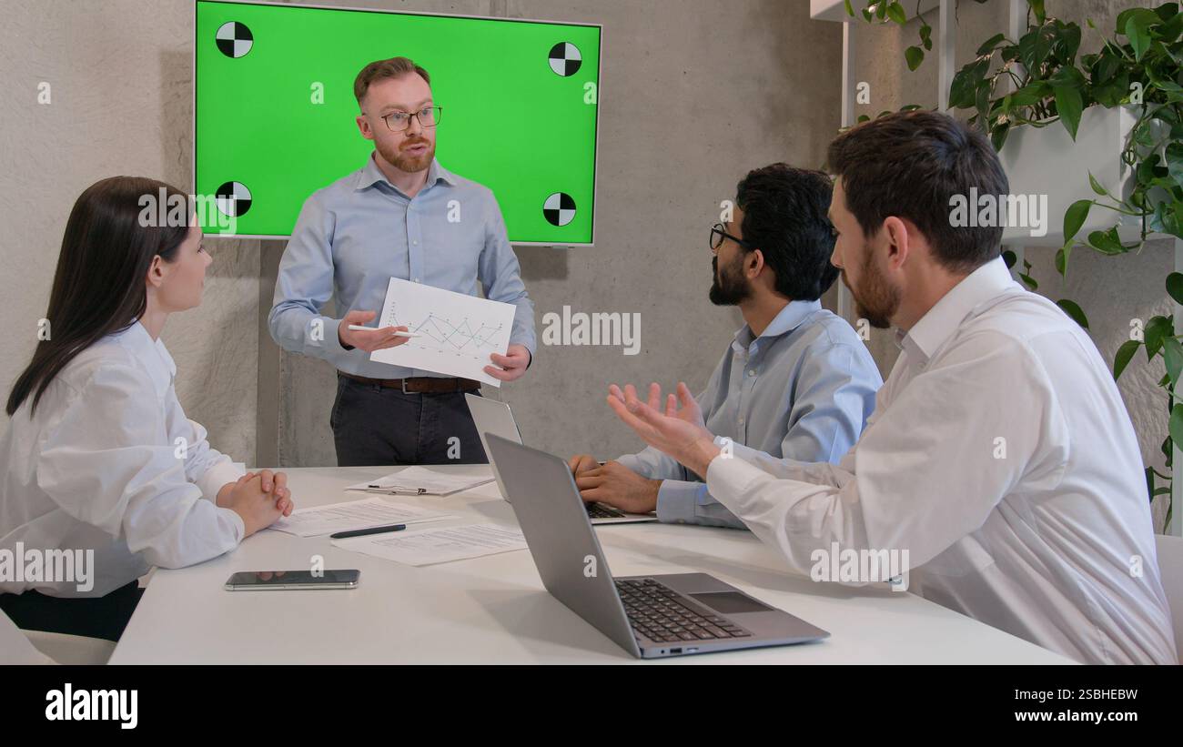 Male leader speaker coach talking to team multiracial men listen to CEO ...