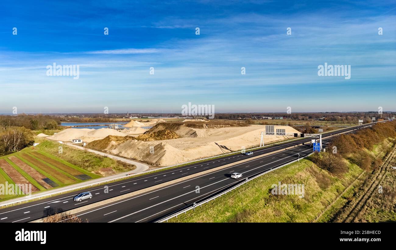 Industrial landscape with highway and cars traffic aerial drone view ...