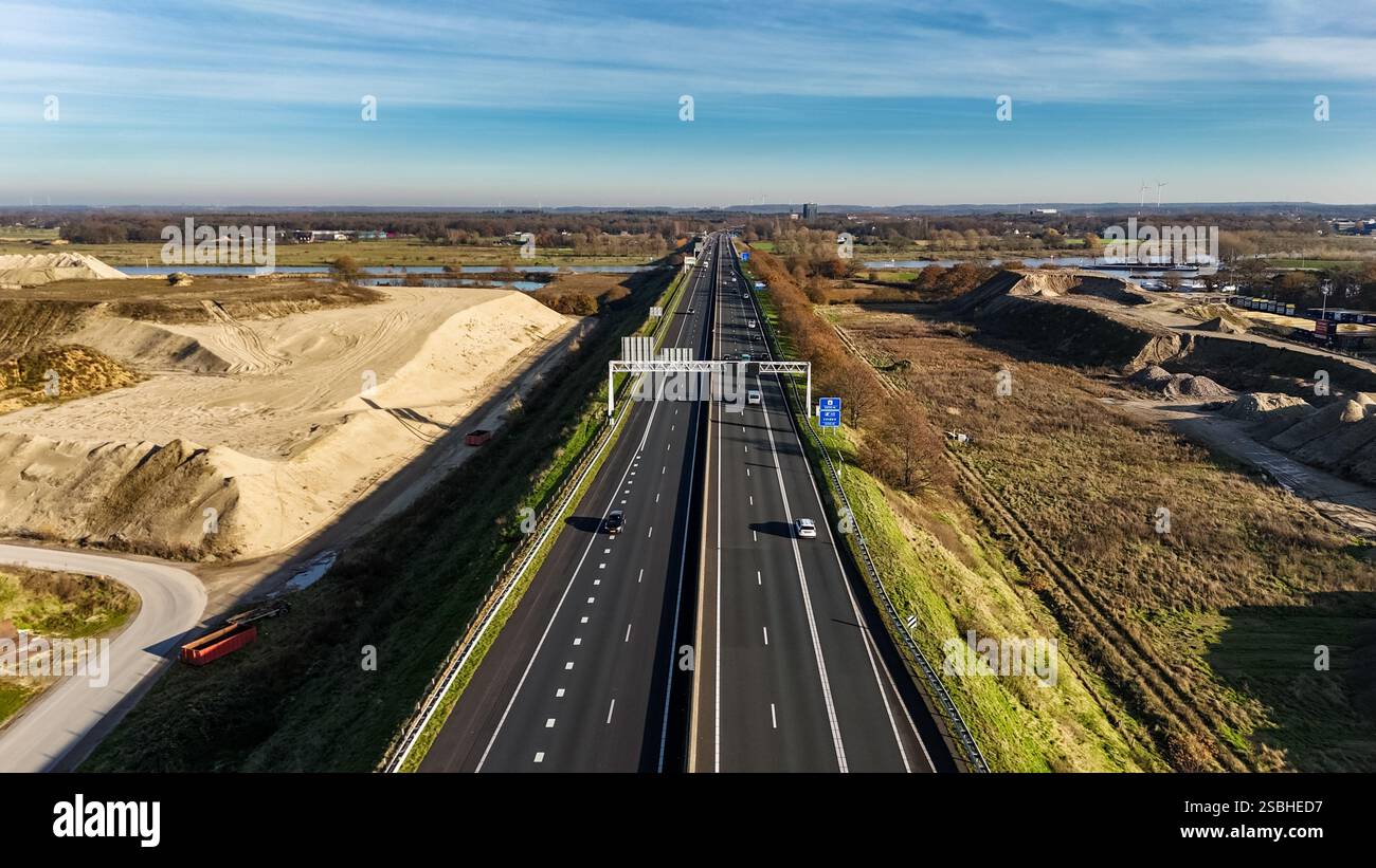 Industrial landscape with highway and cars traffic aerial drone view ...