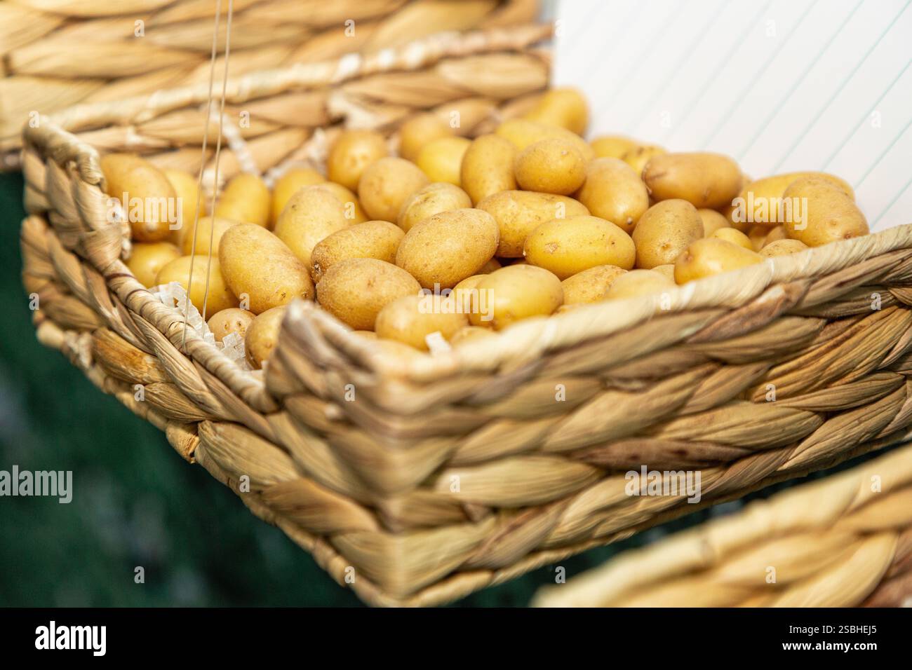 mini potato tubers in a wicker basket. High quality photo Stock Photo ...