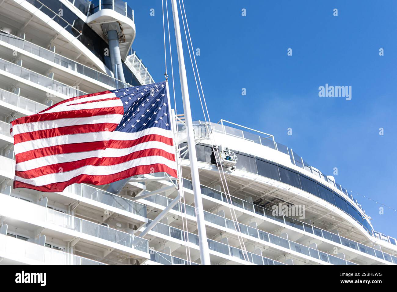 American Flag at half mast in front of cruise ship Stock Photo - Alamy