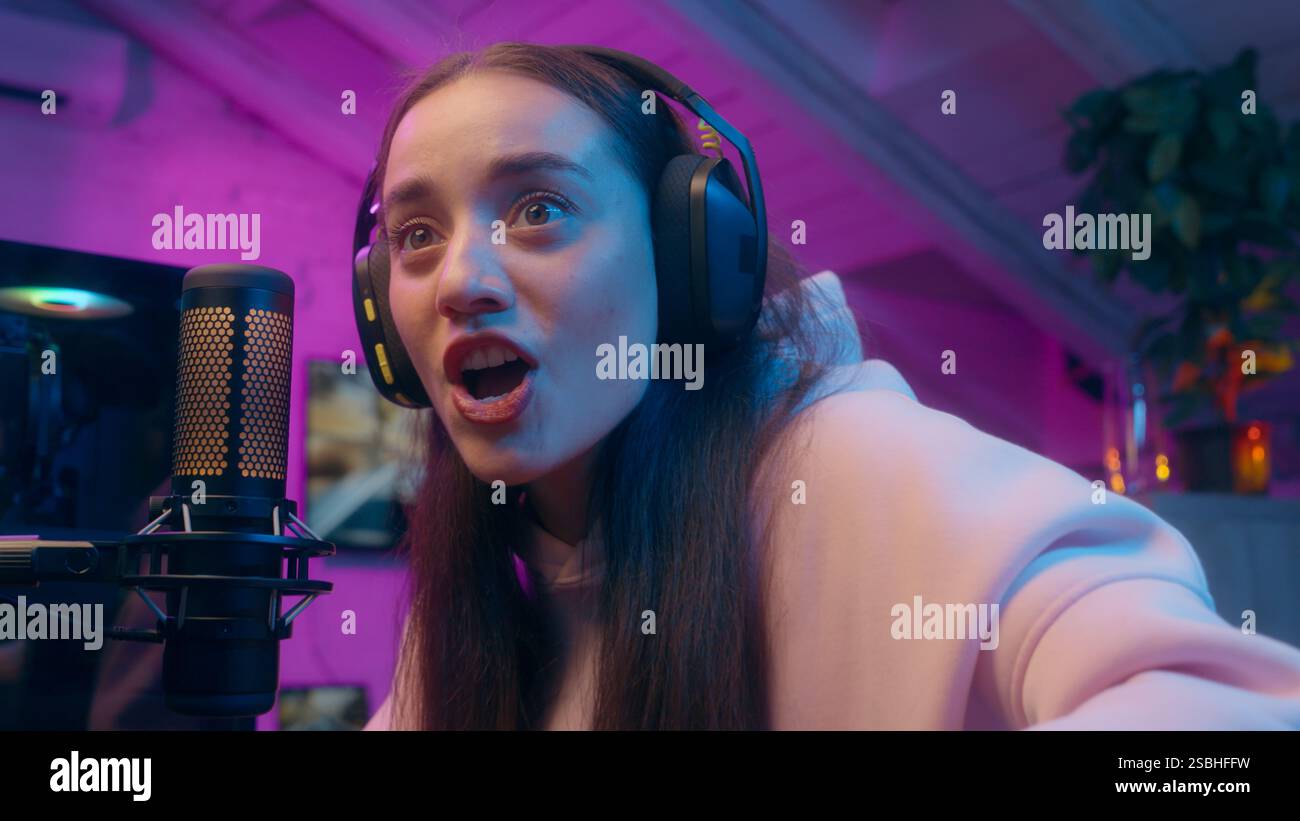 Happy Caucasian girl woman winner playing virtual game computer ...