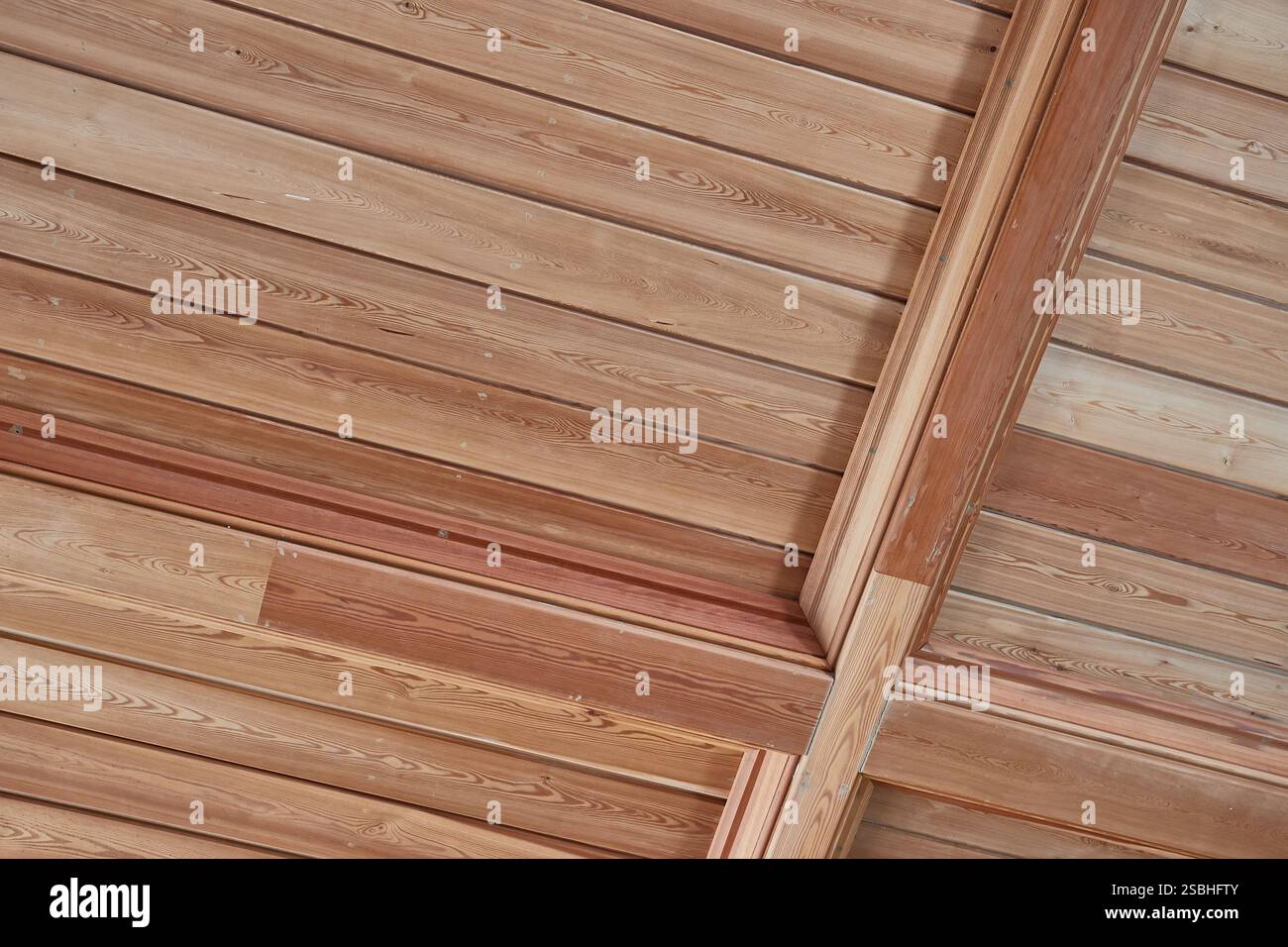 Wooden roof lumber beam structure from inside Stock Photo - Alamy