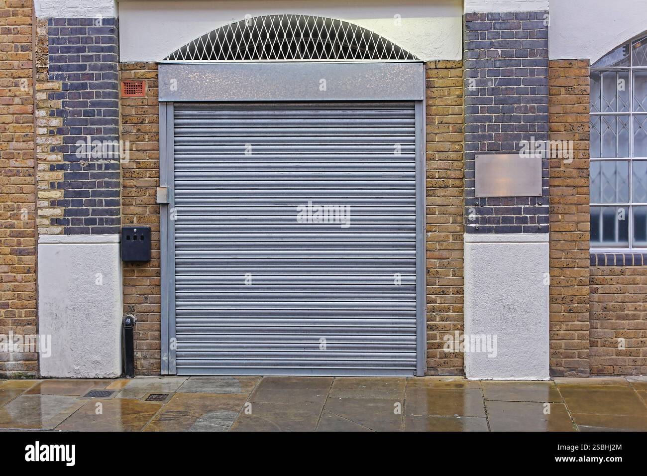 Closed Roll Up Steel Metal Safety Door in London Stock Photo - Alamy