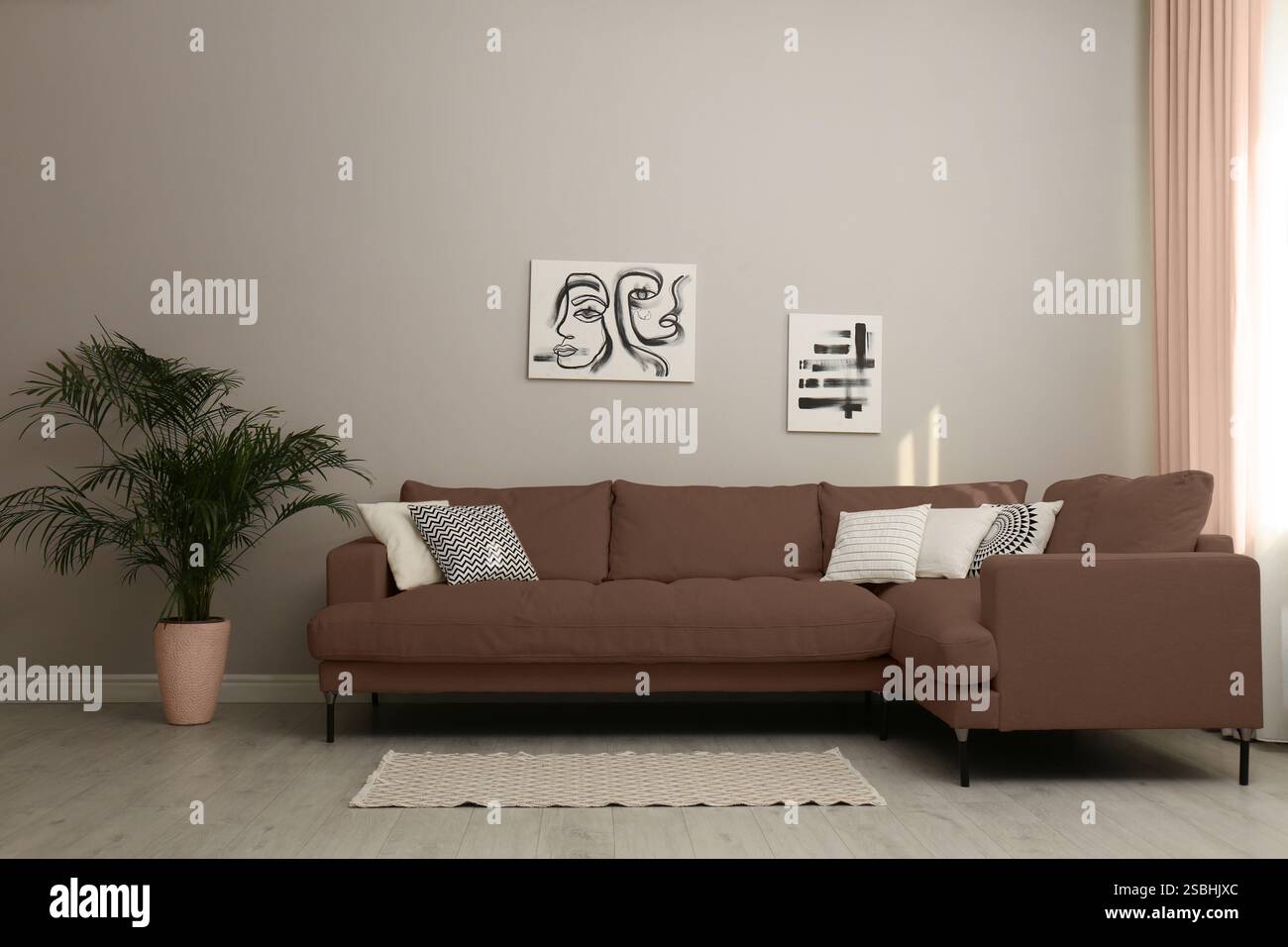 Sofa in mocha mousse shade and decor indoors. Interior with trendy ...
