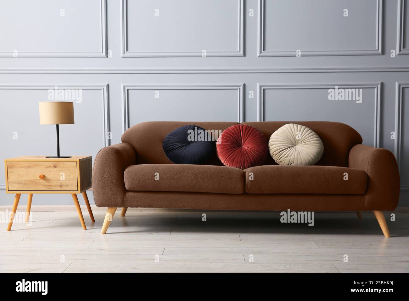 Sofa in mocha mousse shade indoors. Interior with trendy color of 2025 year Stock Photo - Alamy