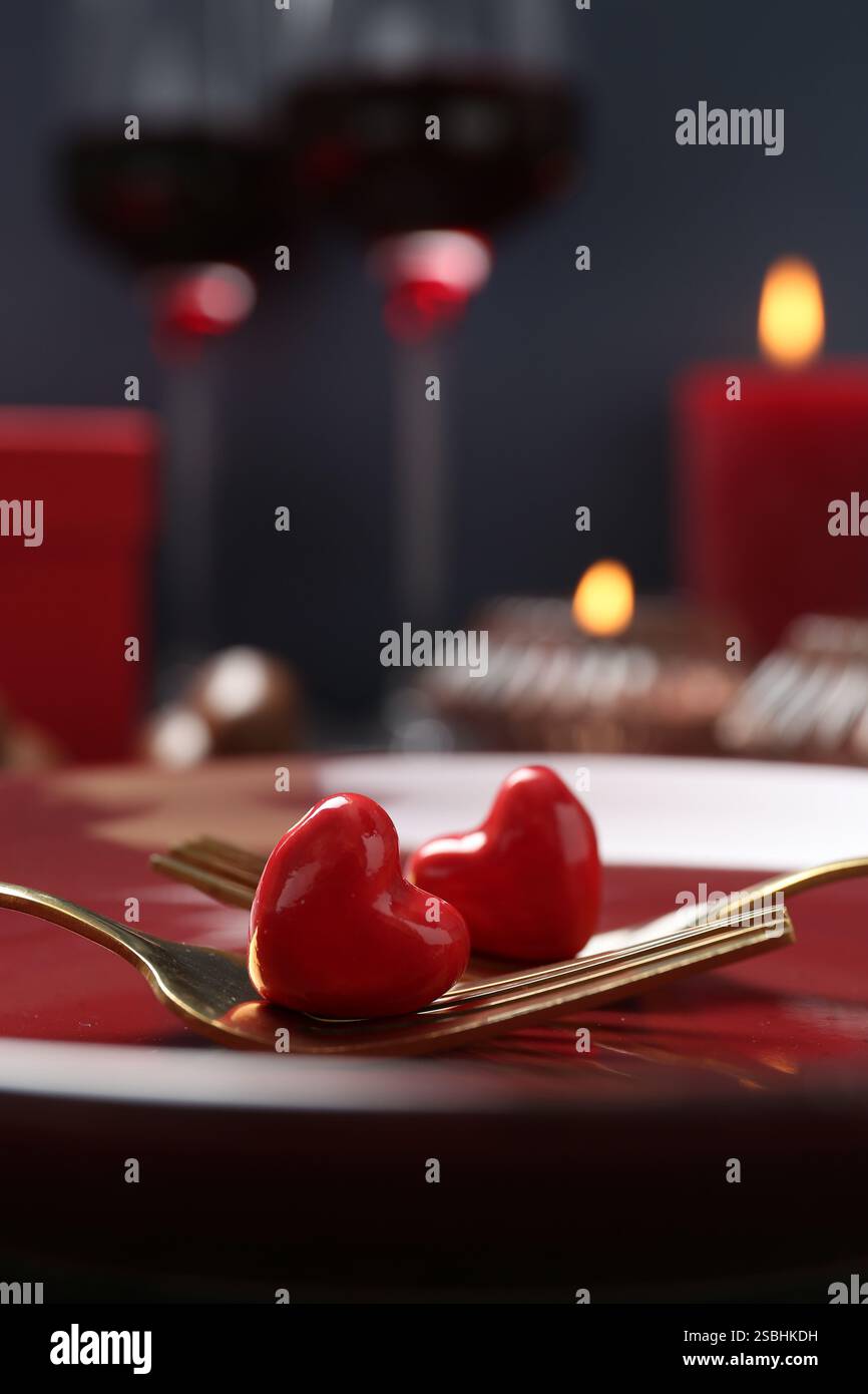 Romantic table setting for Valentine's day. Forks with decorative ...