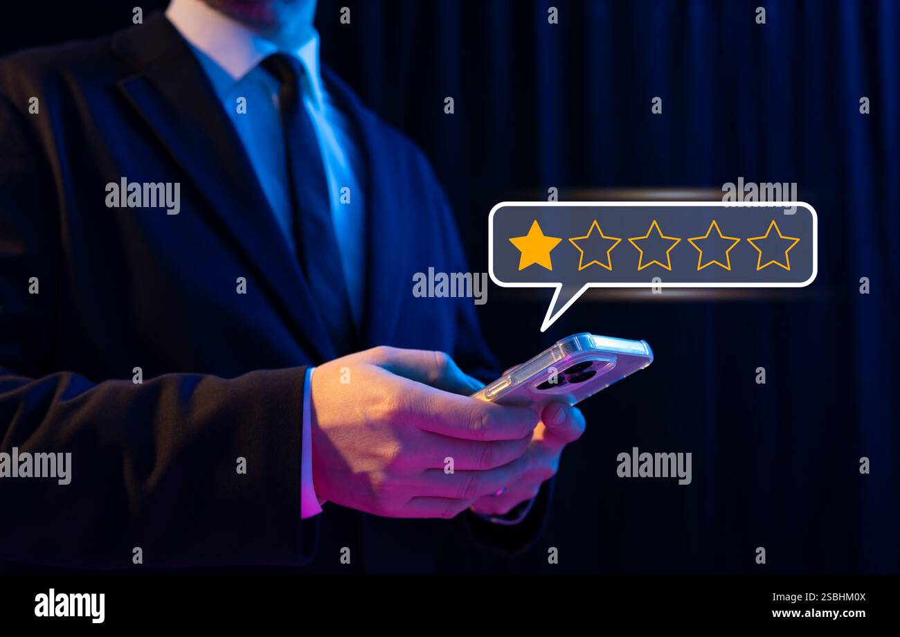 A person using a smartphone to give a one-star rating, representing ...