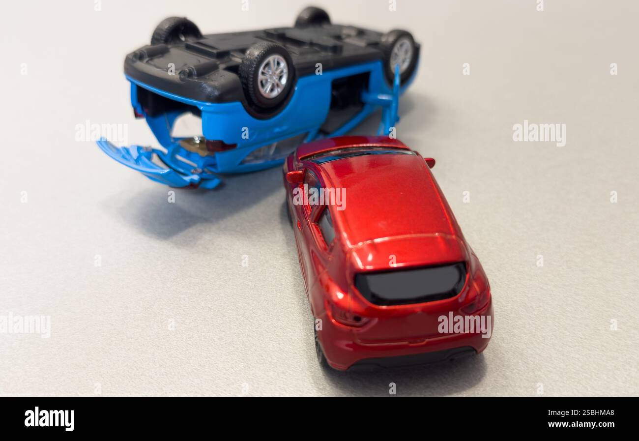 Two mini toy car crash on white background, incident, car traffic ...
