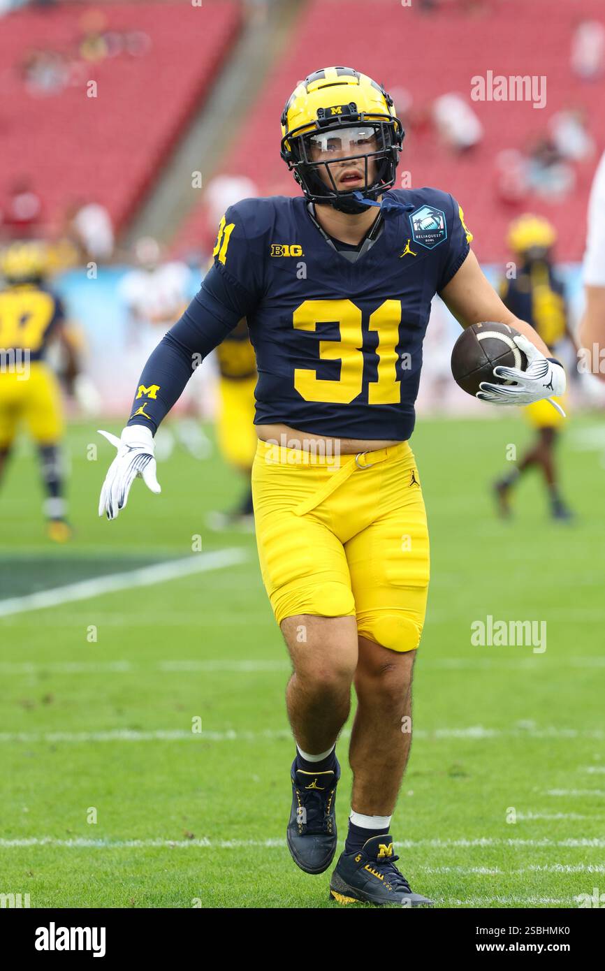 Michigan Wolverines defensive back Max Reyes (31) carries the ball ...