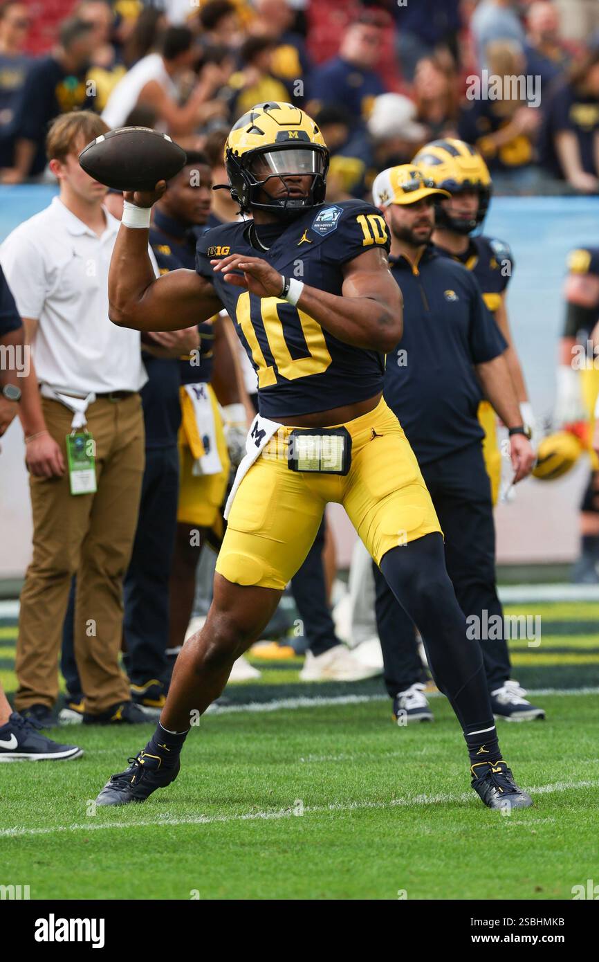 Michigan Wolverines quarterback Alex Orji (10) passes the ball during ...