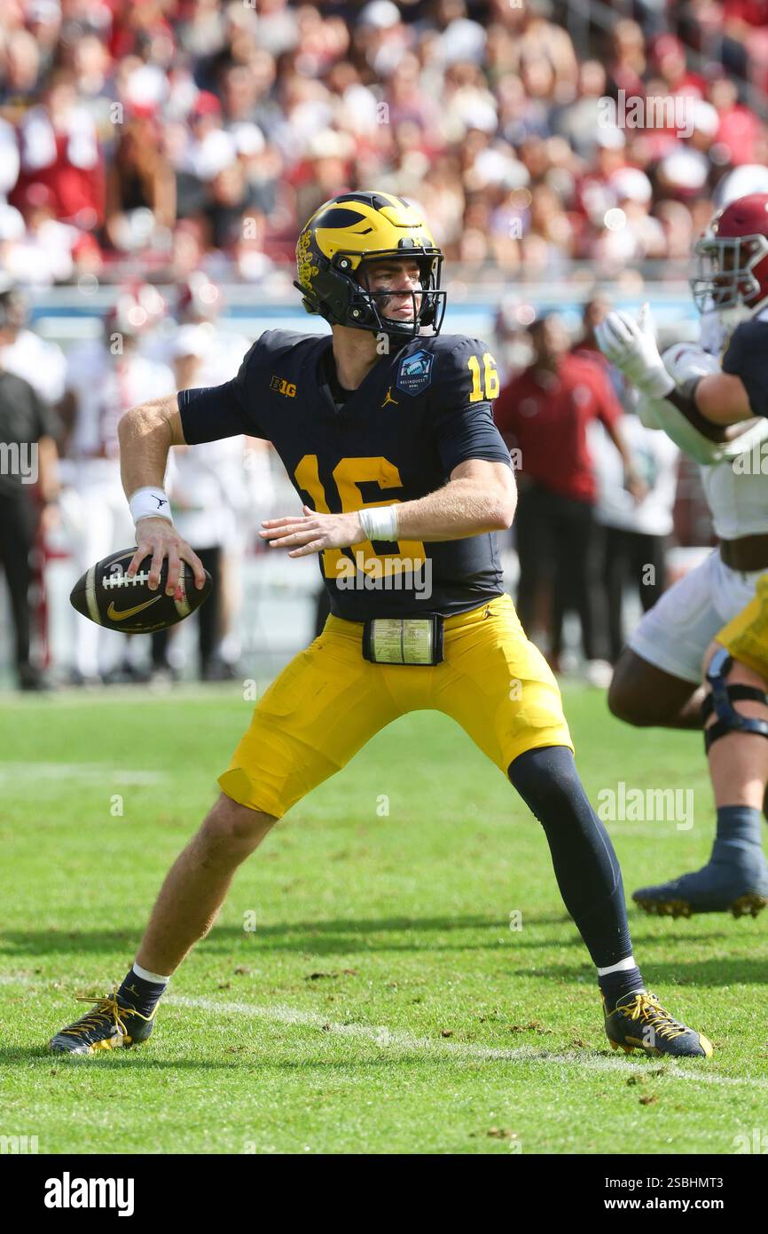 Michigan Wolverines quarterback Davis Warren (16) looks downfield for a ...