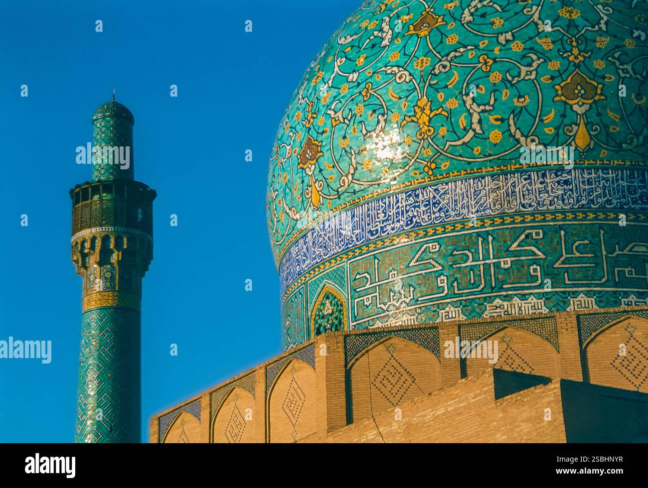 The image is of the Islamic dome and minaret of the Madrese Madar-I ...