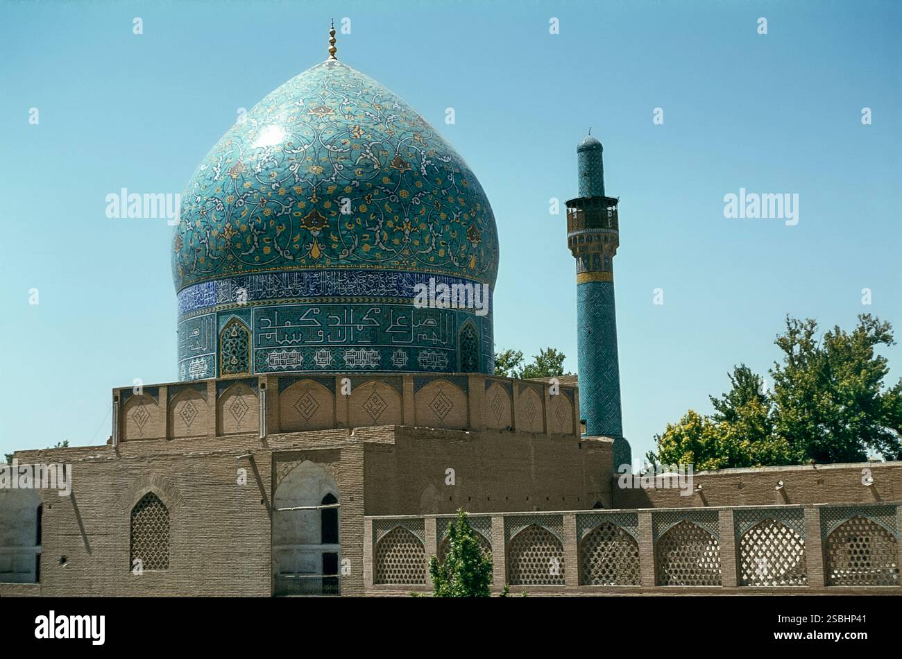 The image is of the Islamic dome and minaret of the Madrese Madar-I ...