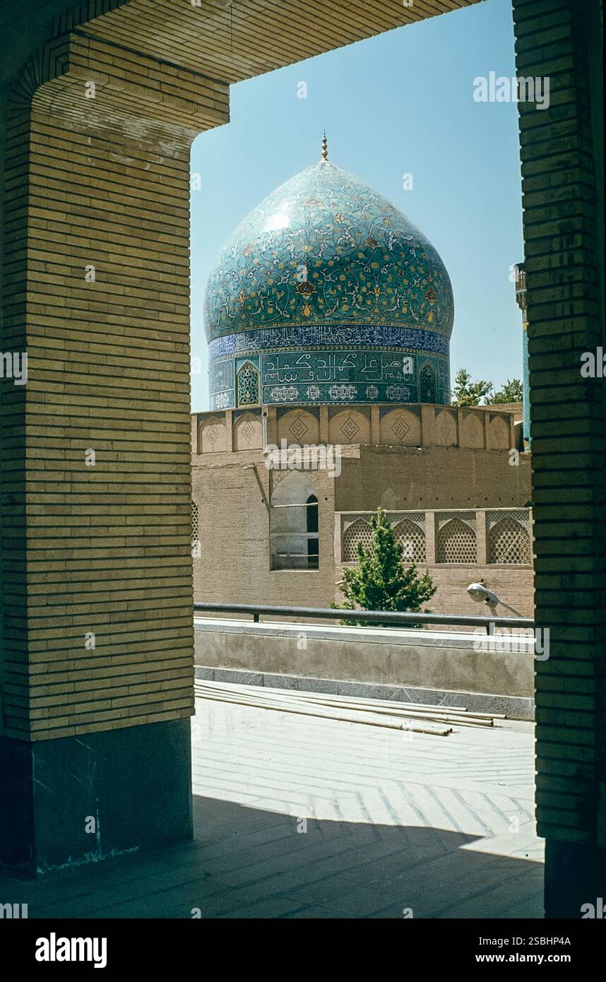 The image is of the Islamic dome and minaret of the Madrese Madar-I ...