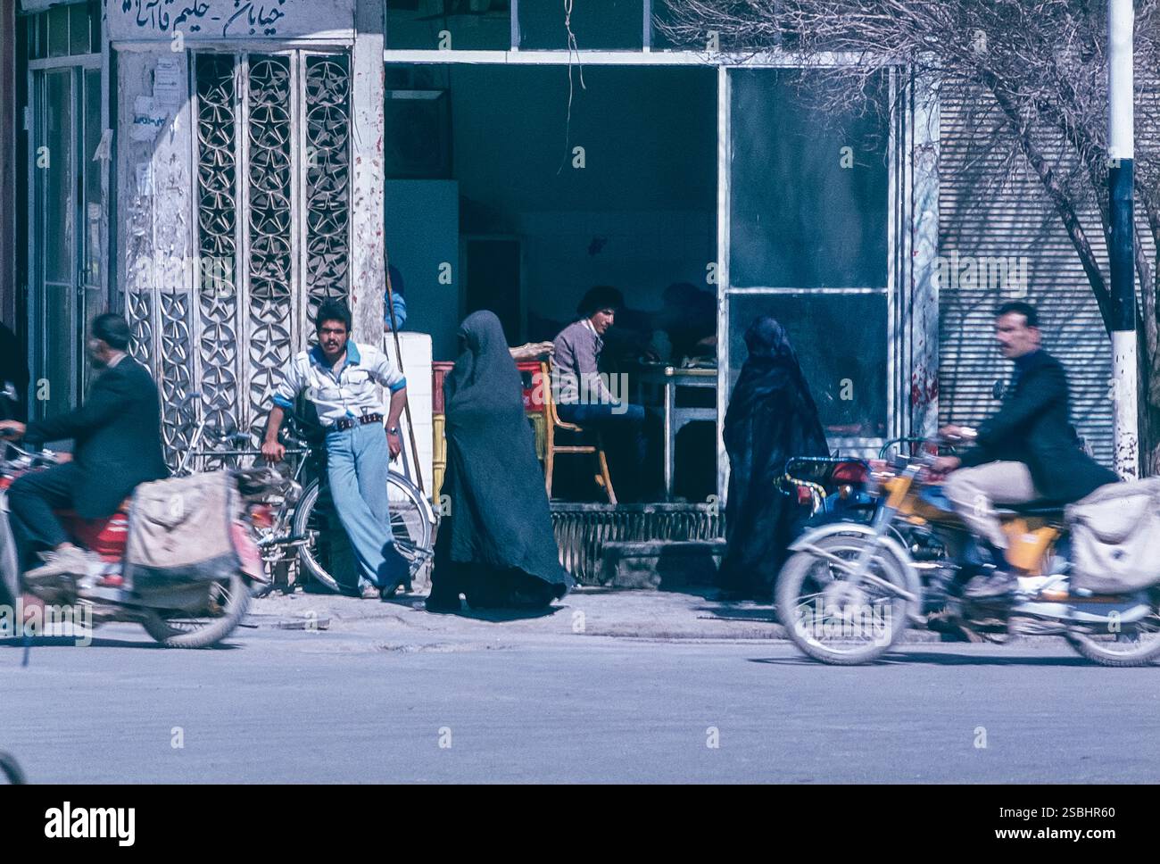 This street scene image is of general life outside a Kebab House cafe ...