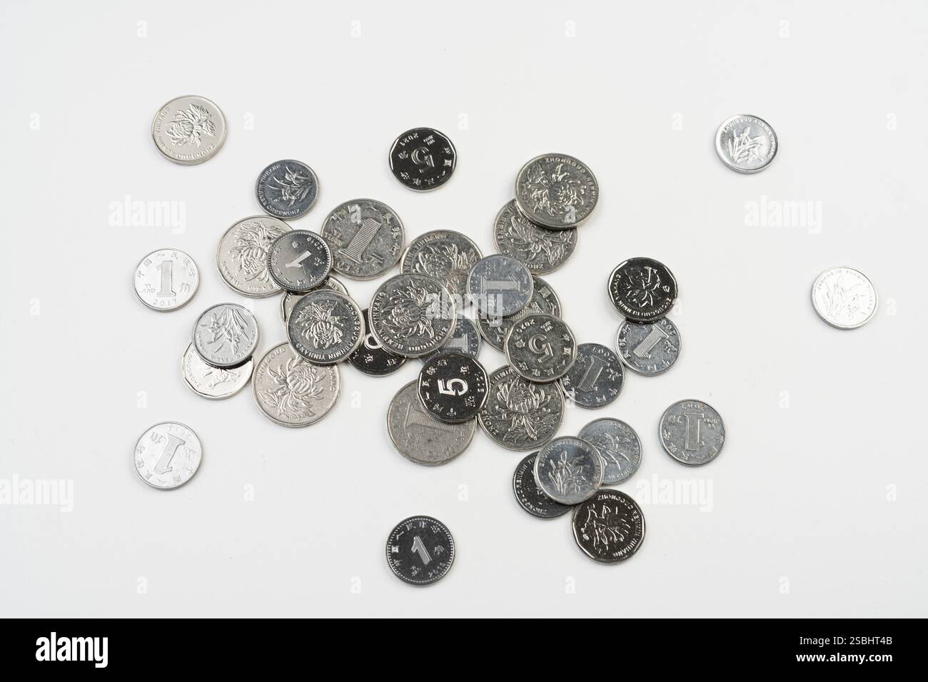 Some chinese Renminbi coins on a white background Stock Photo - Alamy
