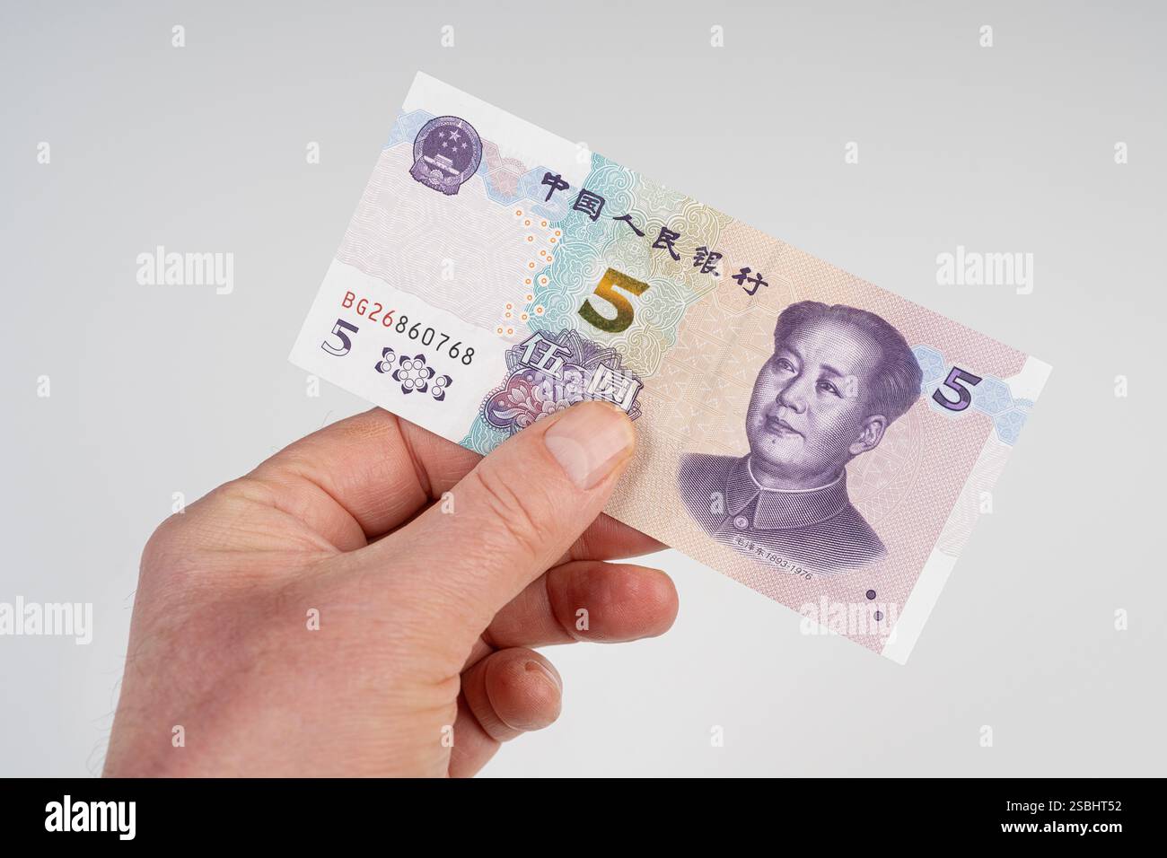 A 5 Yuan banknote in the hand Stock Photo - Alamy