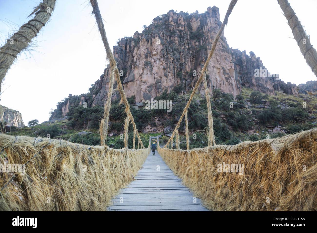 Authentic wooden and grassy bridge across river in Peru Stock Photo - Alamy