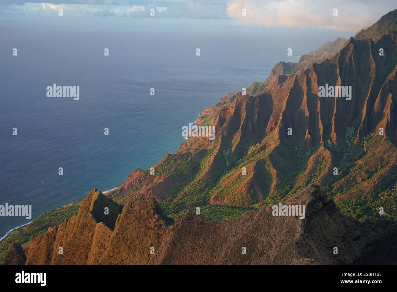 Golden light over the Na Pali Coast, Kauai, highlighting its dramatic ...