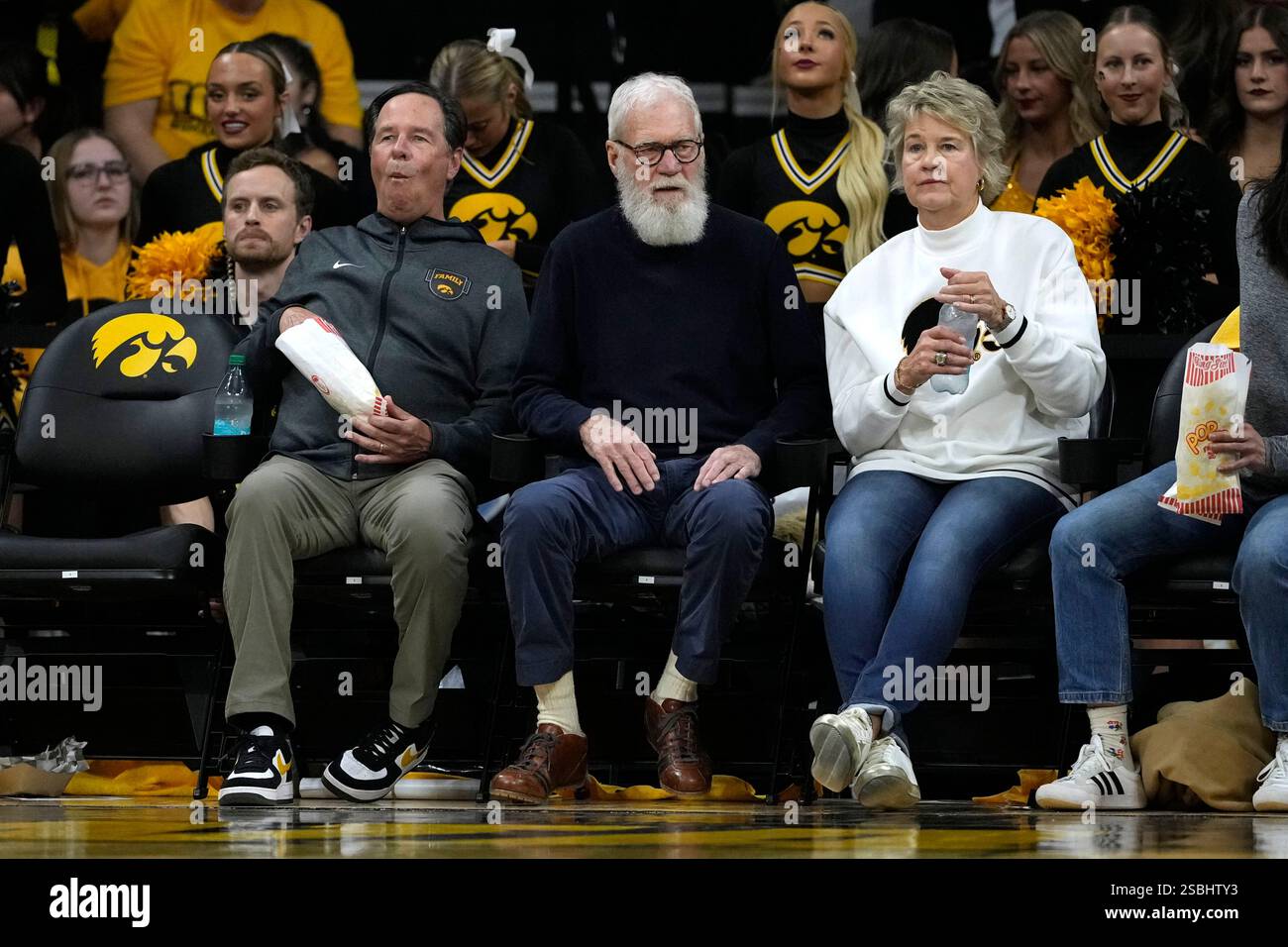 David Letterman, center, sits with former Iowa coach Lisa Bluder, right ...