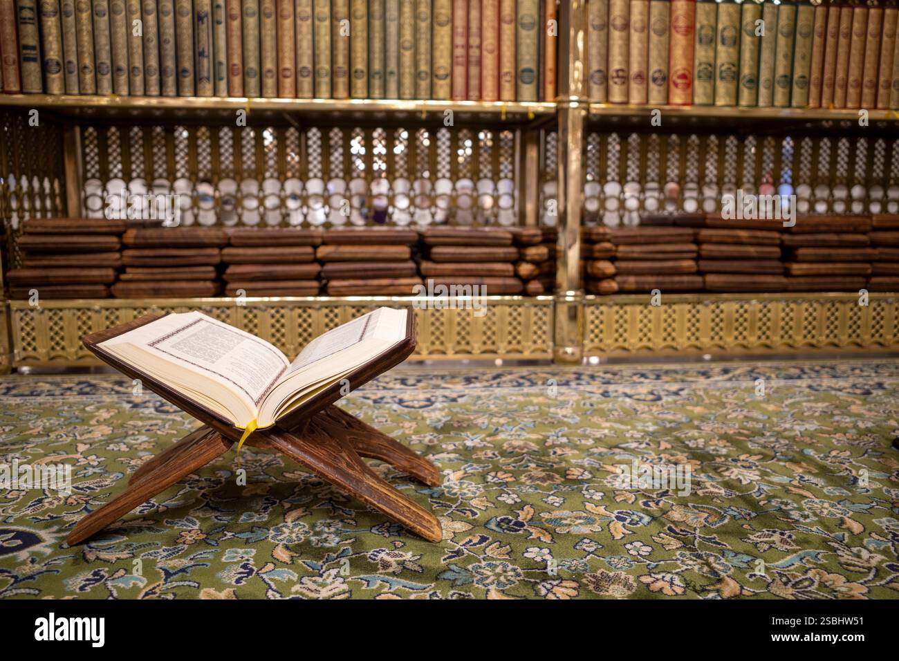 The holy book of the Quran is opened on a green carpet at the Prophet ...