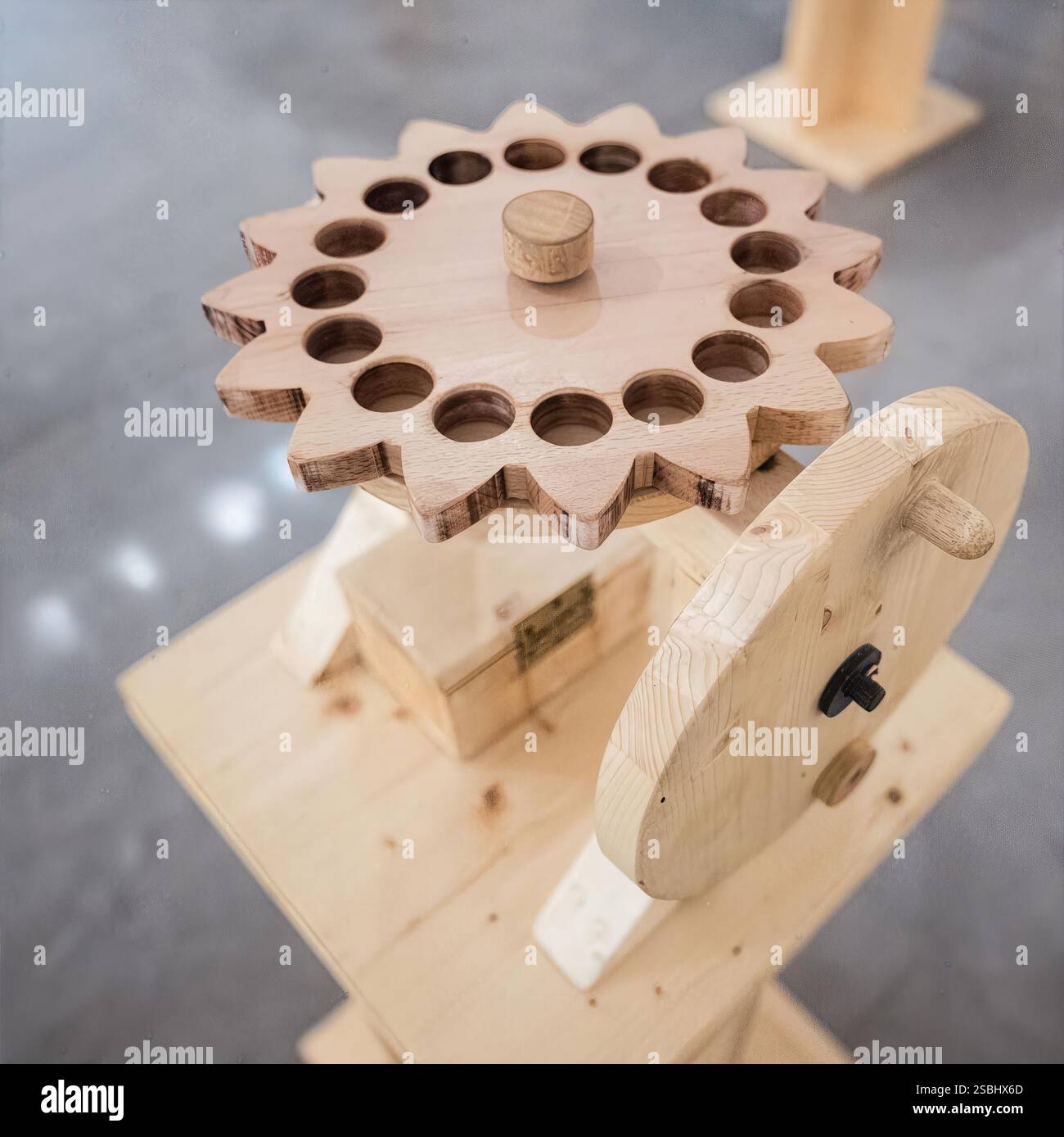 Artistic display of wooden mechanical gears and spheres, showcasing ...