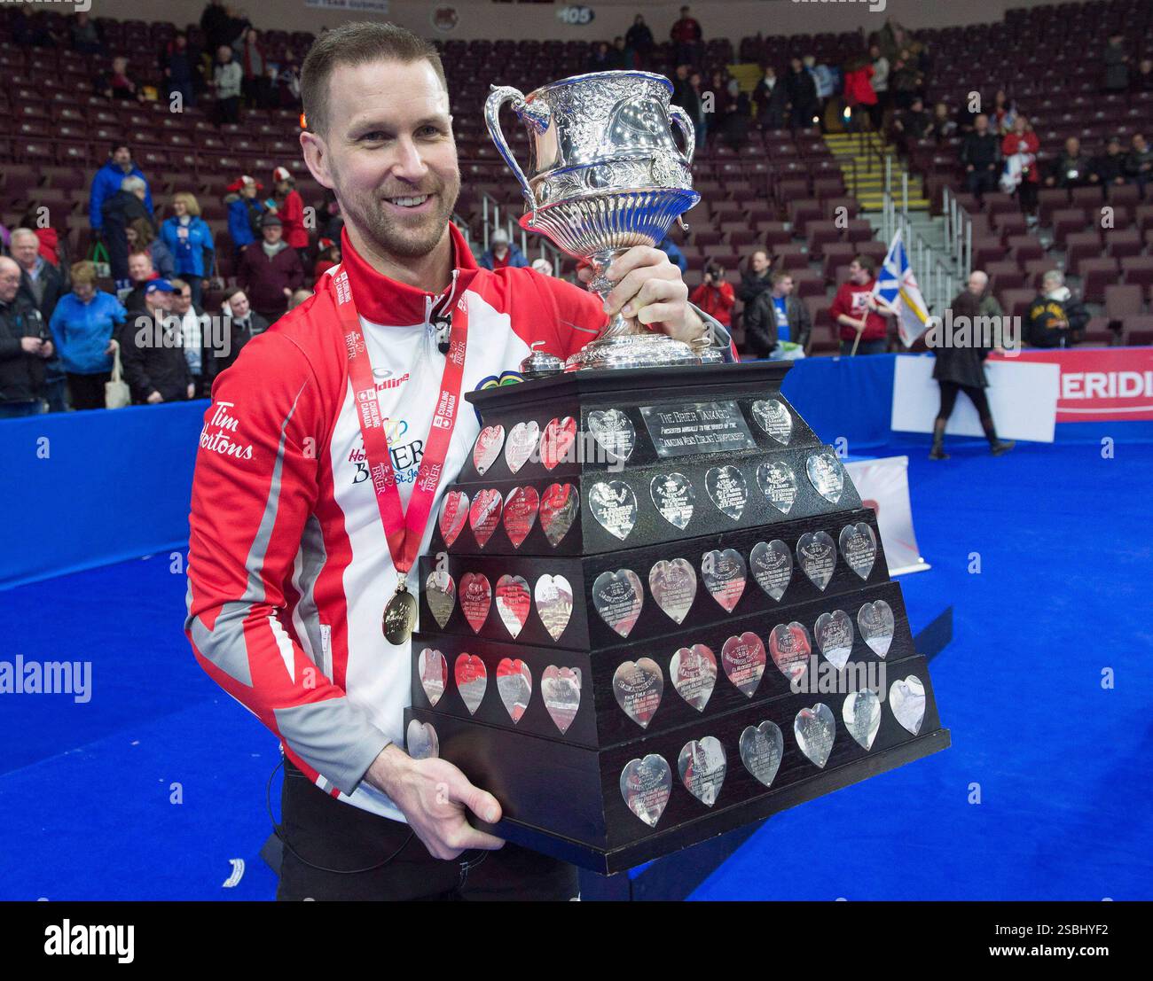 Newfoundland and Labrador skip Brad Gushue holds the Brier Tankard ...