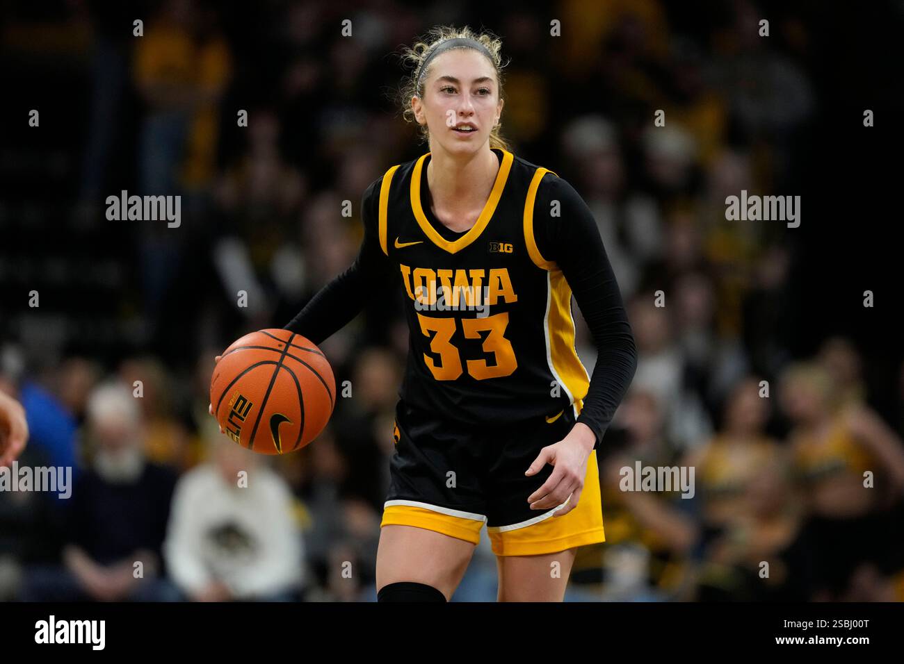 Iowa guard Lucy Olsen drives up court during the second half of an NCAA ...