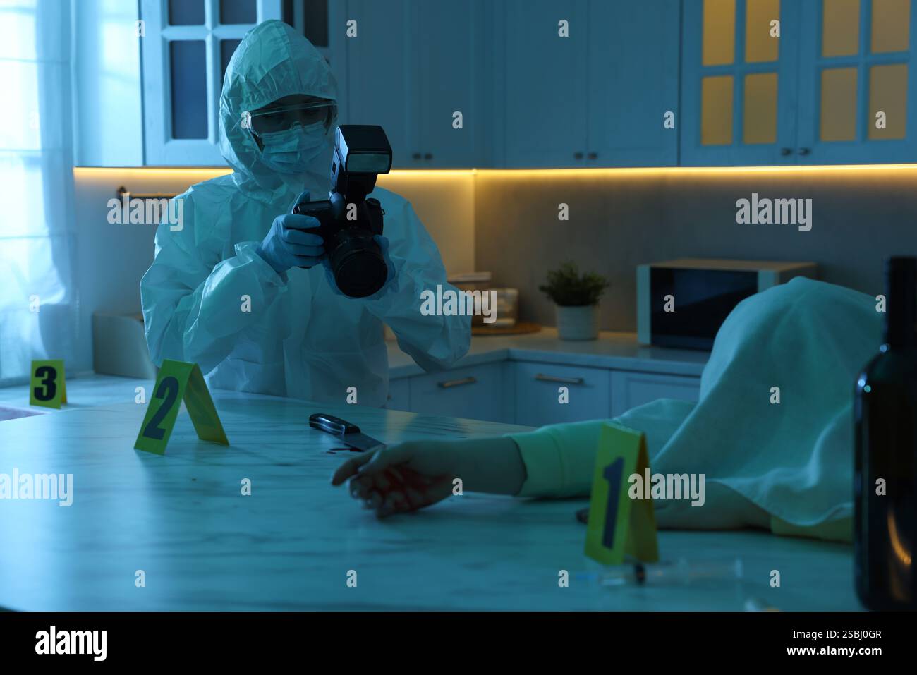 Forensic expert with camera working at crime scene and dead woman's ...