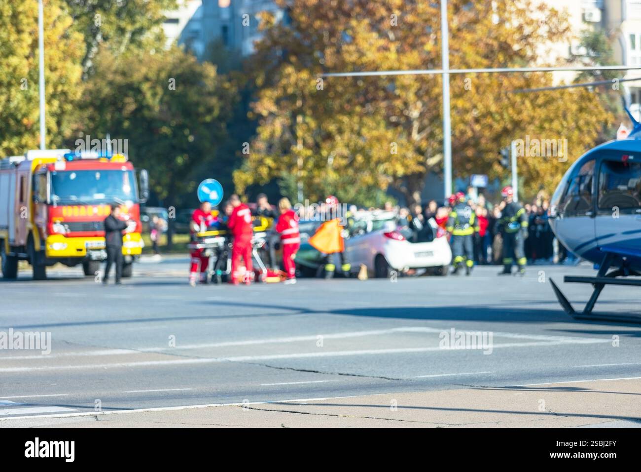 Emergency response team actively managing a car accident scene in an ...
