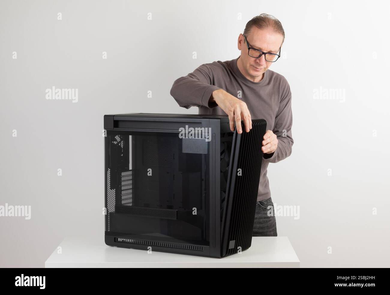 Man removing 15.5 mm front panel grille with 45% porosity with dust ...