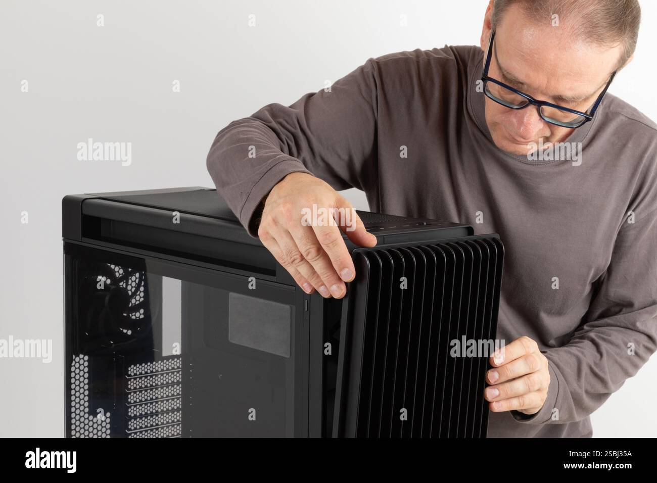 Man removing 15.5 mm front panel grille with 45% porosity with dust ...