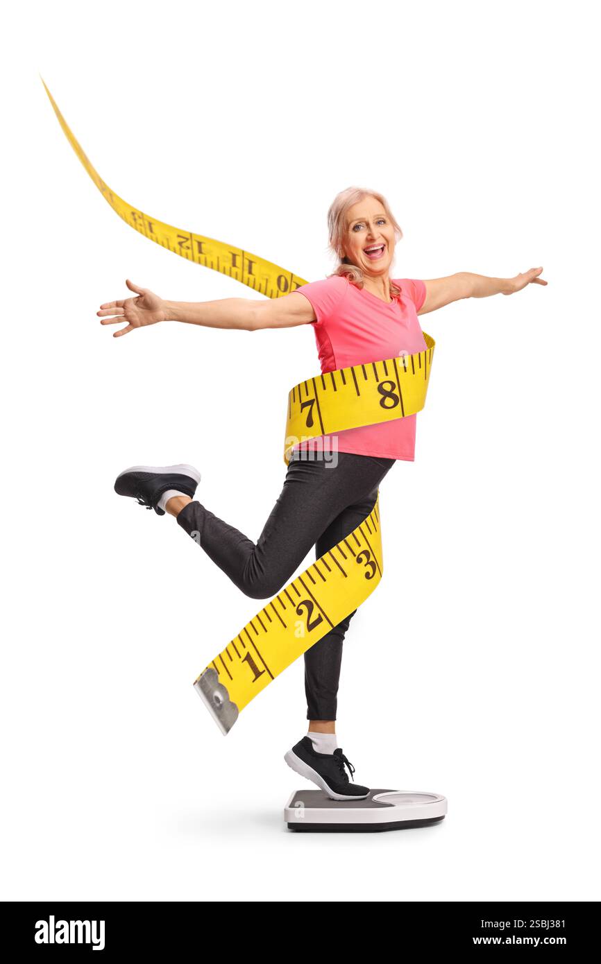 Smiling mature woman with a measure tape on a weight scale isolated on ...