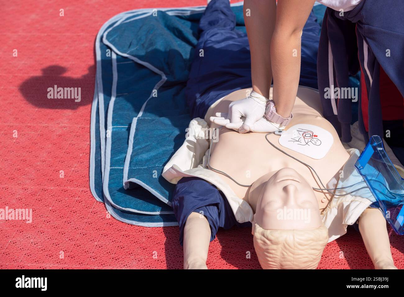 AED - Automated External Defibrillation during CPR and first aid certification course Stock ...