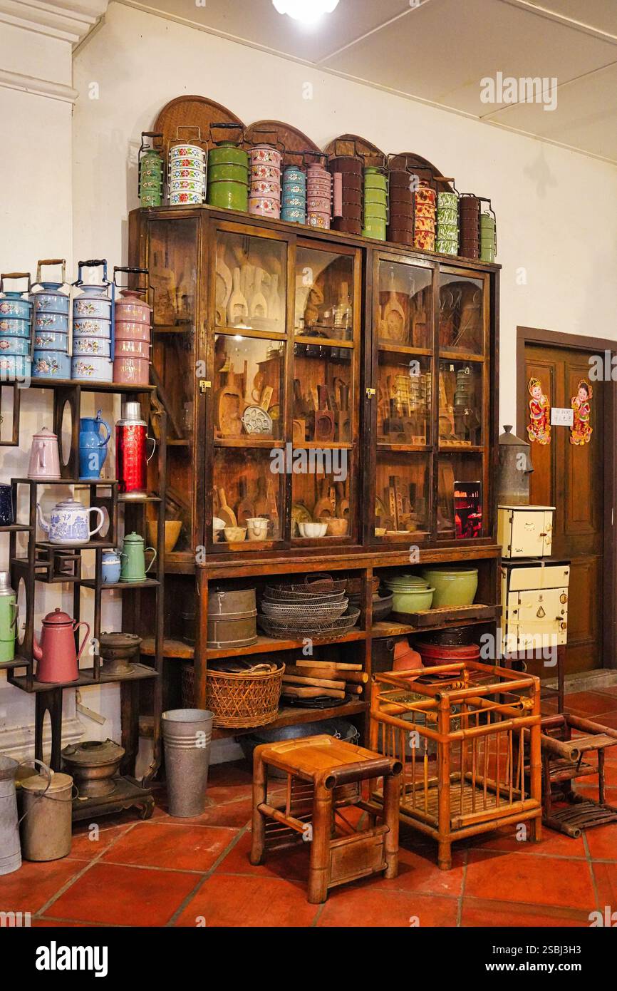 Kitchen area showcasing vast variety of steel tiffin boxes and wooden ...