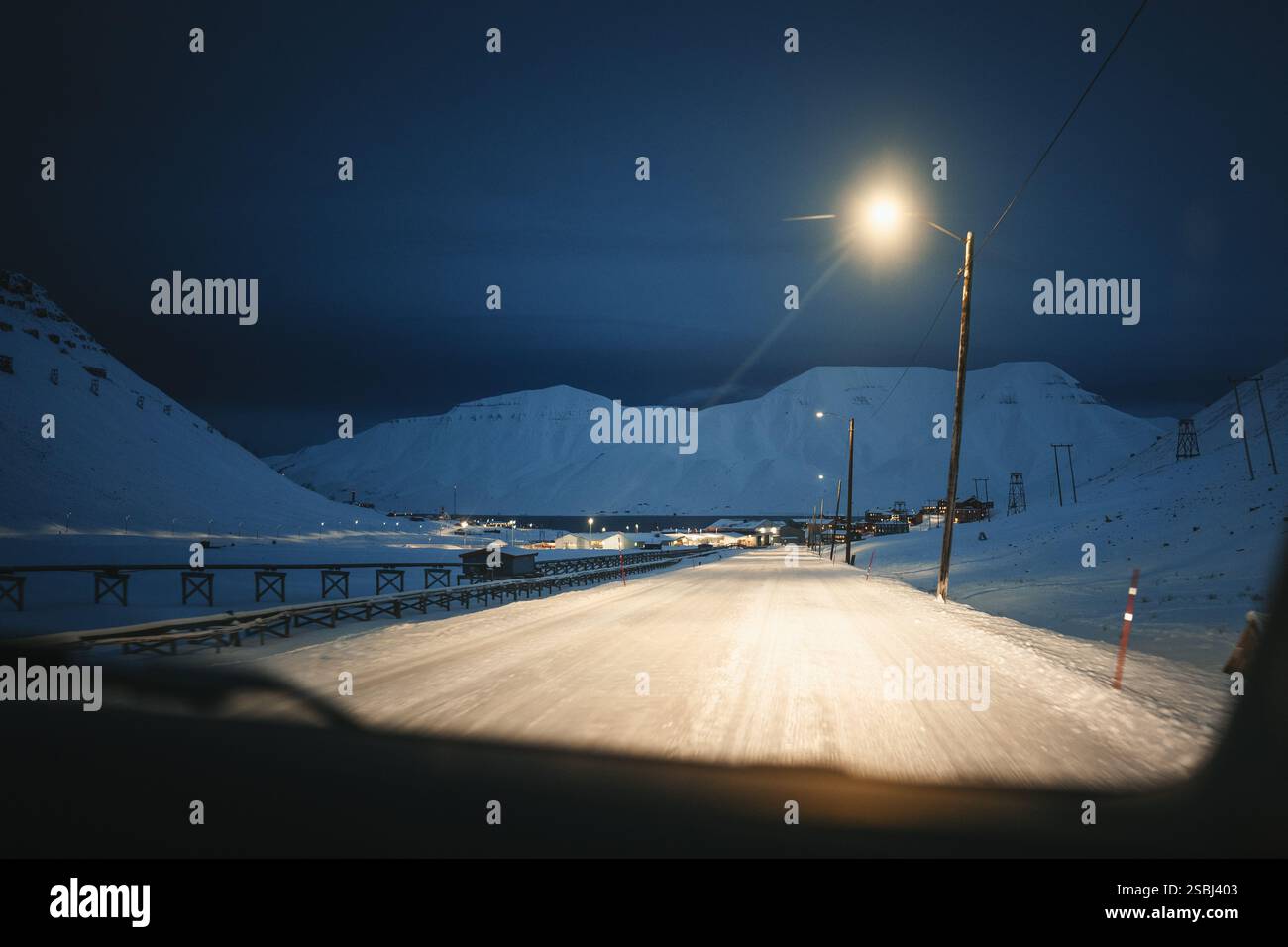 View out front window of car on snowy road in Longyearbyen, Svalbard ...
