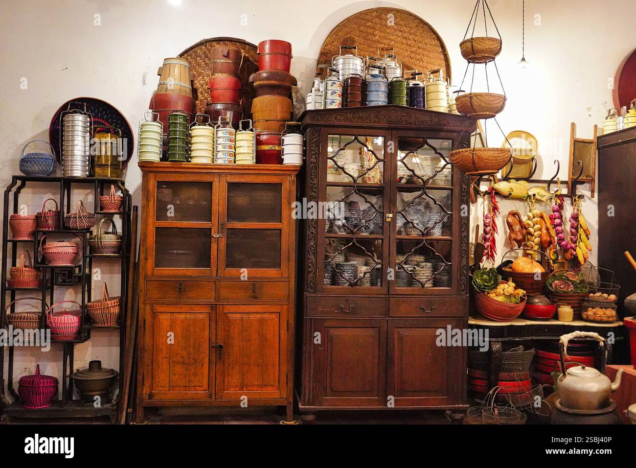 Kitchen area showcasing vast variety of steel tiffin boxes and wooden ...