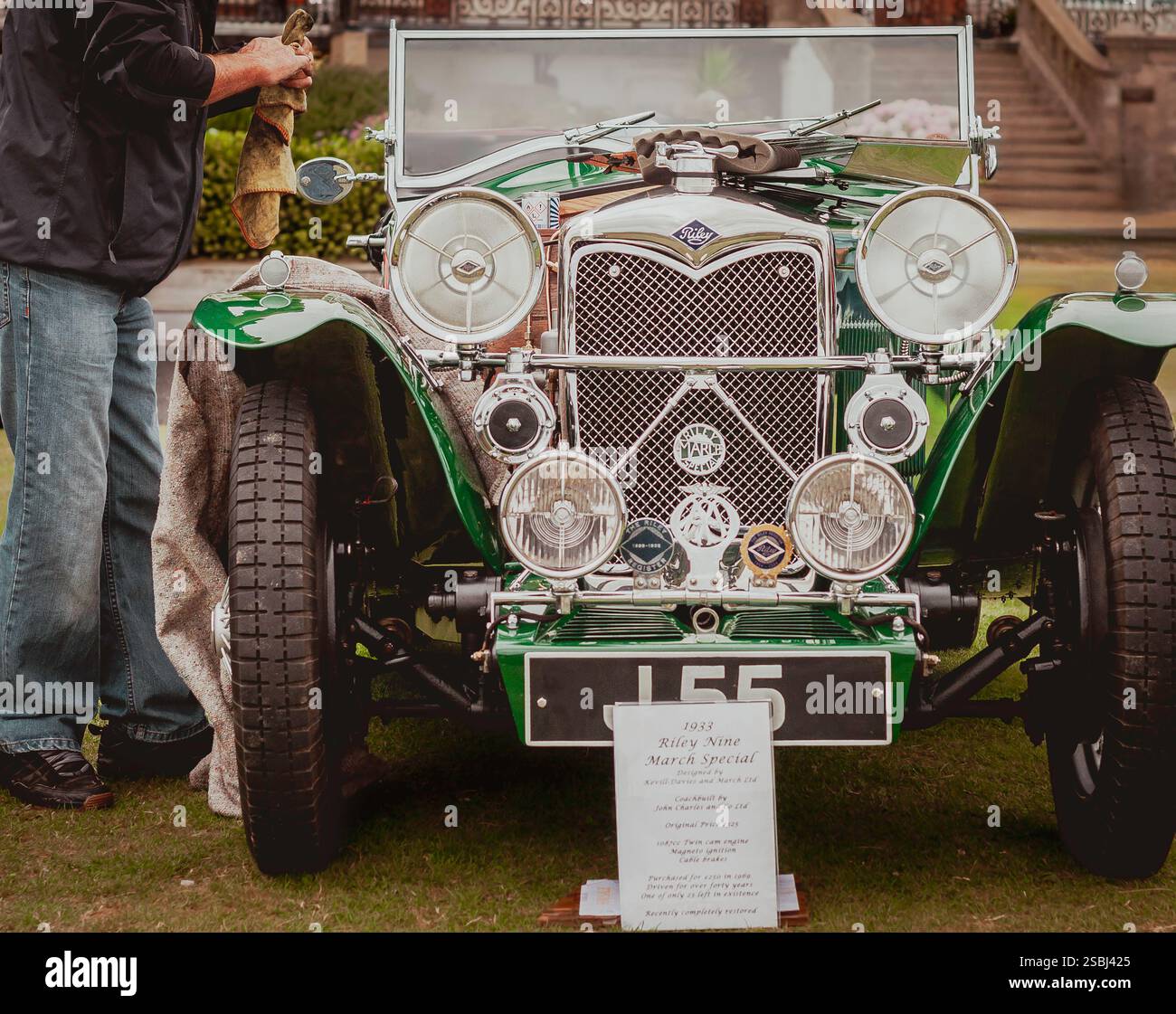 A person performing maintenance on a classic car Stock Photo - Alamy