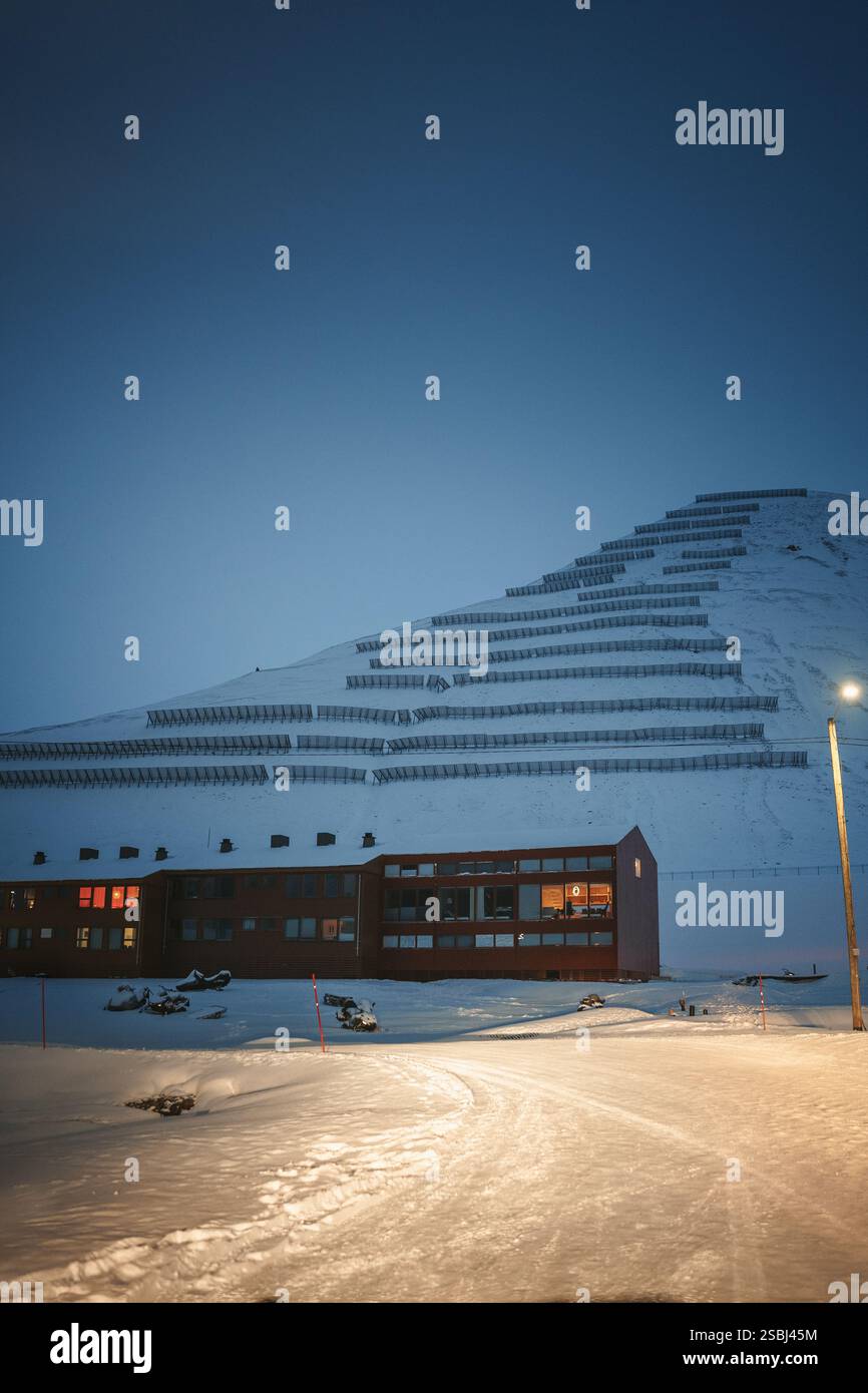 Avalanche barriers behind building in Longyearbyen, Svalbard in the ...