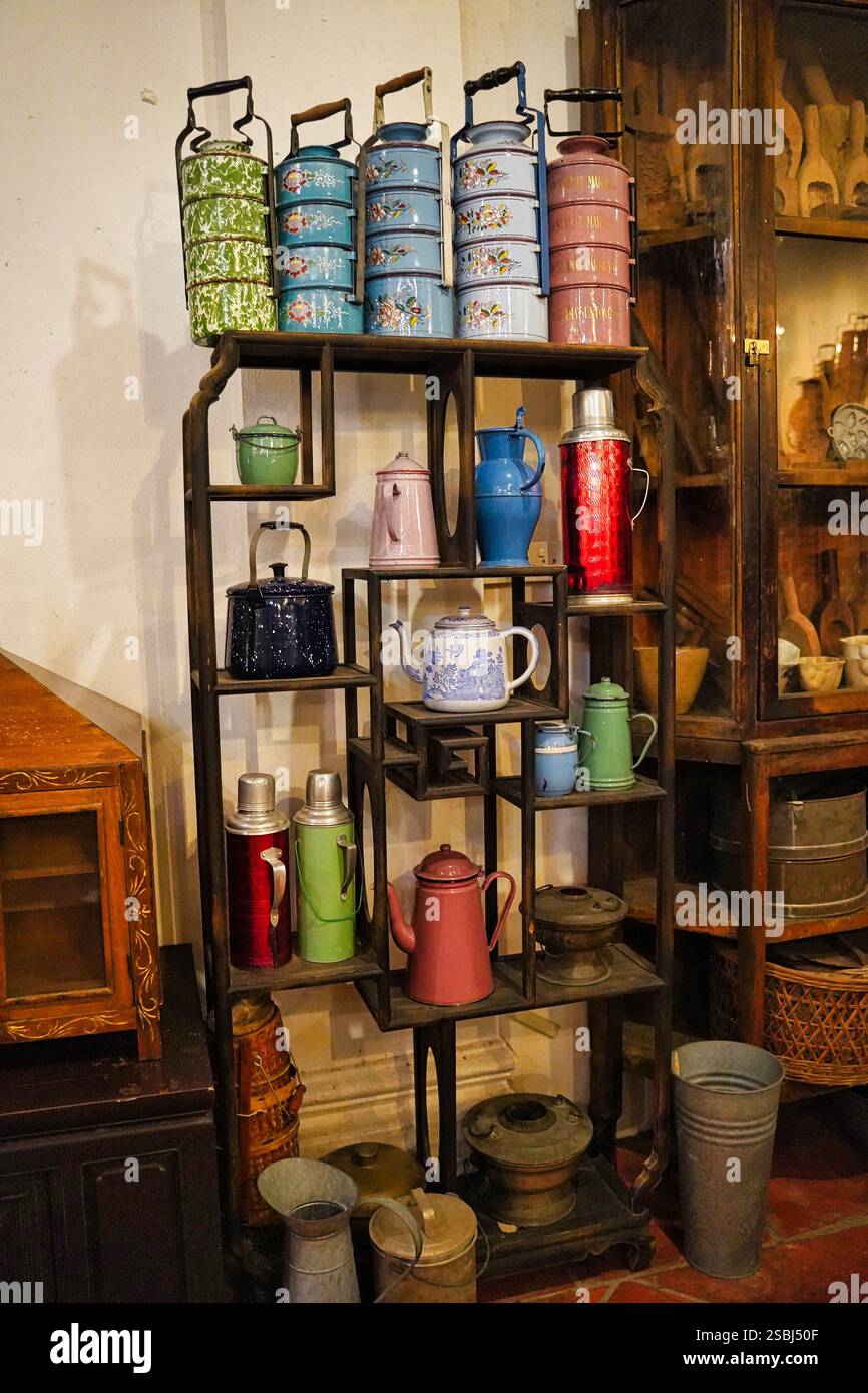 Kitchen area showcasing vast variety of steel tiffin boxes and dried ...