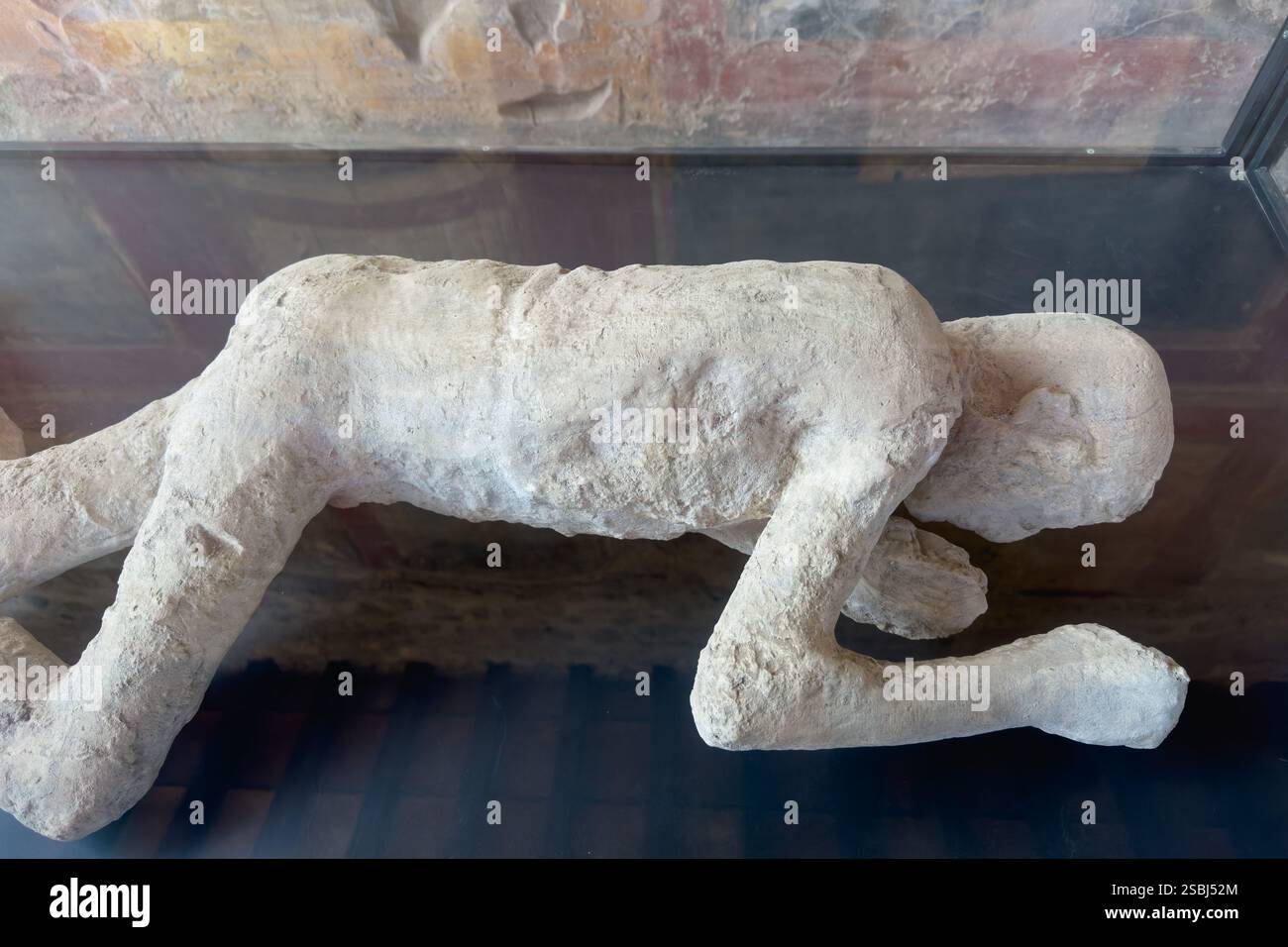 Plaster cast of a victim of the volcanic eruption, displayed in the ...