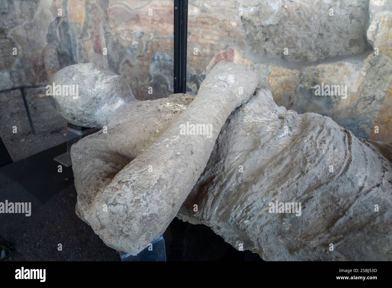 Plaster cast of a victim of the volcanic eruption, displayed in the ...