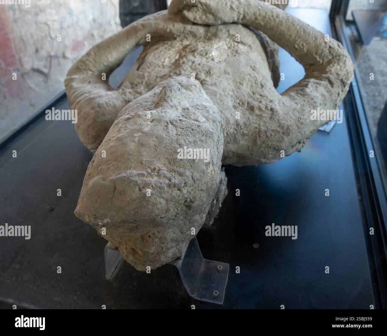 Plaster cast of a victim of the volcanic eruption, displayed in the ...