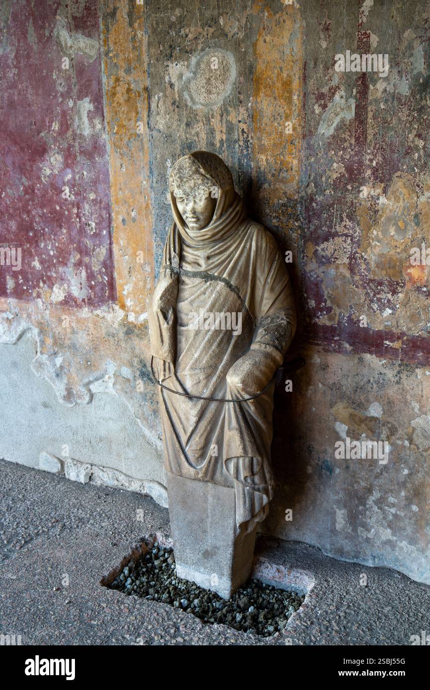 A marble statue of a woman in the Stabian Baths of Terme Stabiane of ...