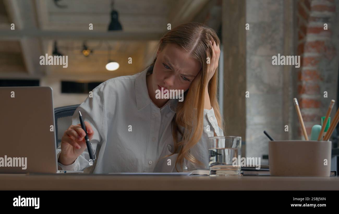 Stressed Caucasian office female worker woman student girl work reading ...