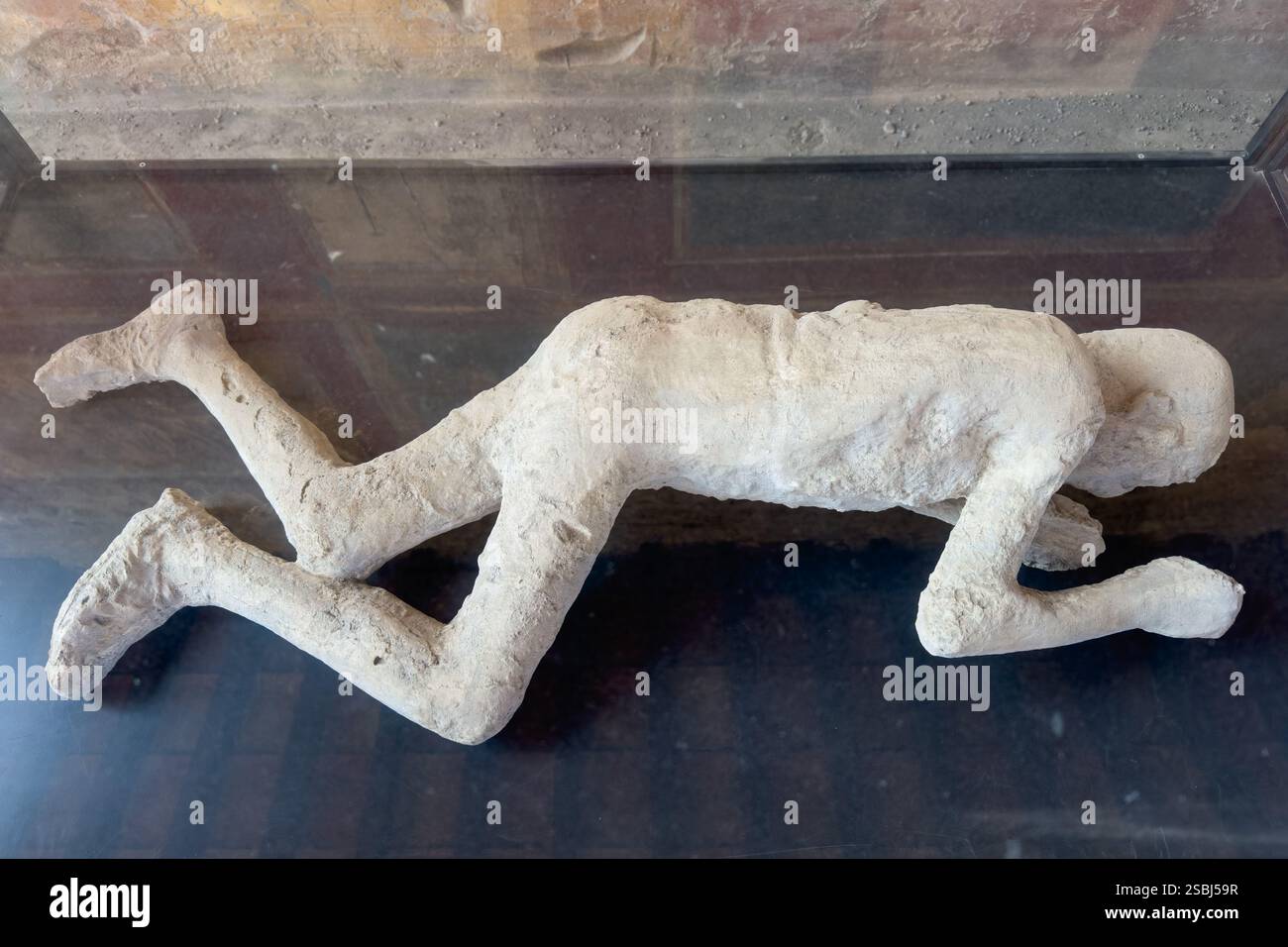 Plaster cast of a victim of the volcanic eruption, displayed in the ...