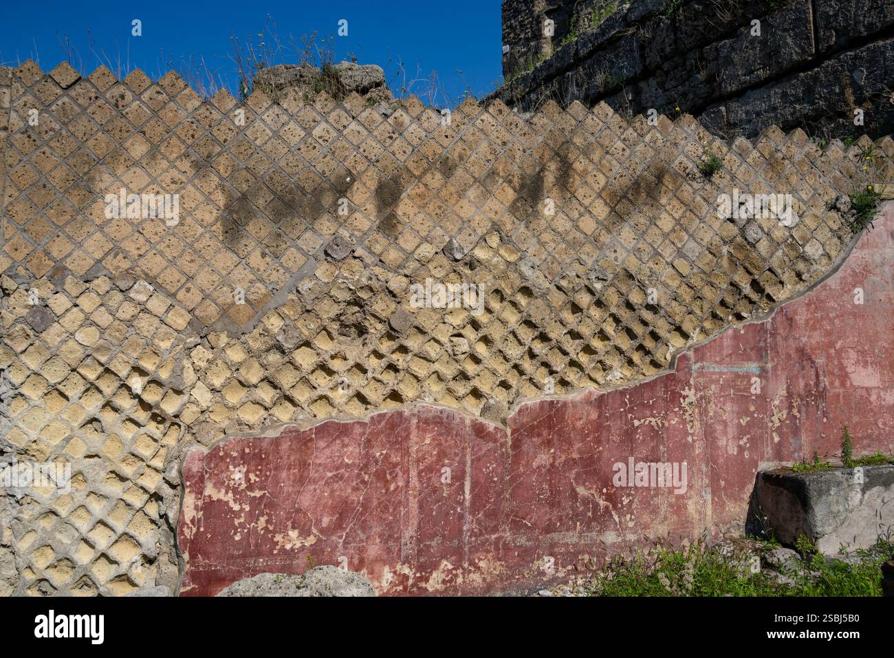 Decorative brick work & painted stucco on the wall of the Suburban ...