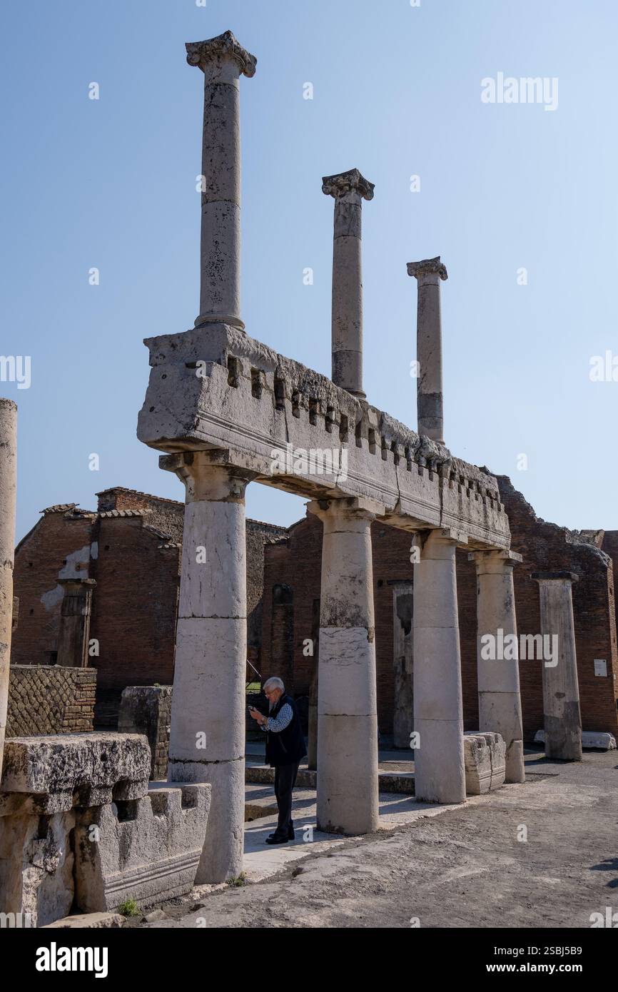 Columns along the Forum at the east end of the Basilica in the ancient Roman ruins of Pompeii ...